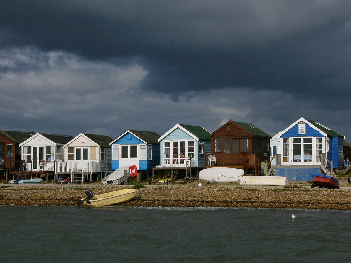 "Beach huts at Mudeford" by Reg Talbot at PicturesofEngland.com